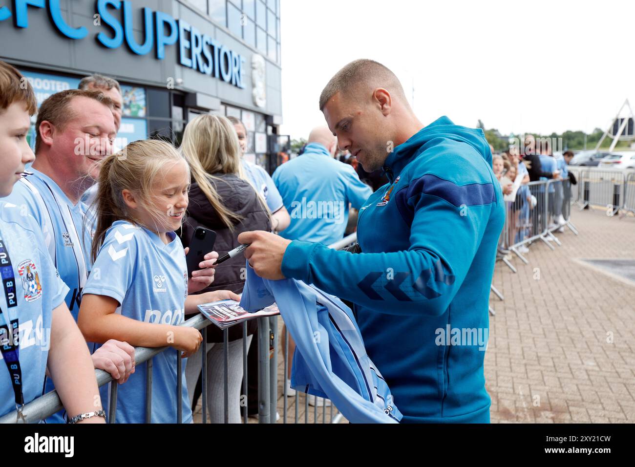 Coventry City's Jake Bidwell signs autographs for fans as he arrives ...