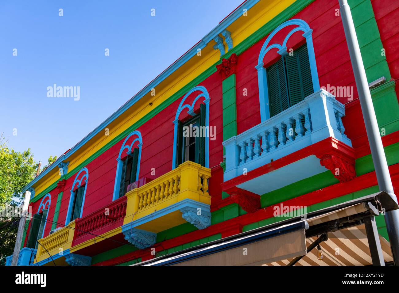 Colorfully painted balconies on buildings along Magallanes Street in ...