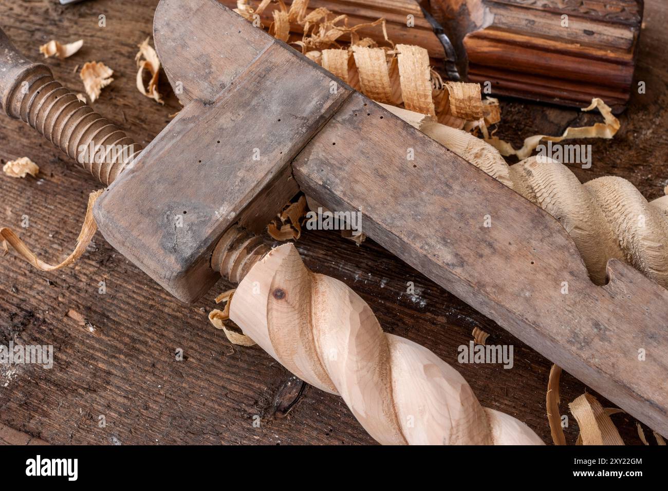 twisted wooden column fixed by an old vice Stock Photo - Alamy
