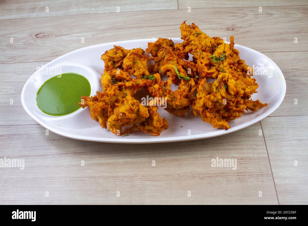 Indian snack ,Tea Time snack Pakoda/kanda bhaji or pyas pakoda ried ...