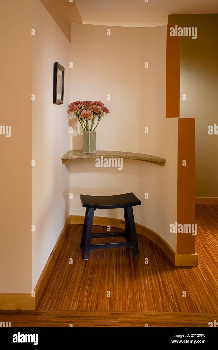 Small nook in curved wall with counter and stool Stock Photo - Alamy