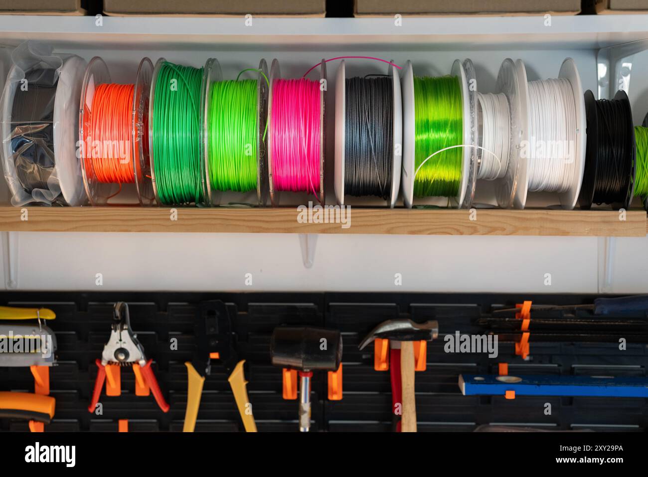 3d print colorful filament. filament spools. Tools wall Stock Photo - Alamy
