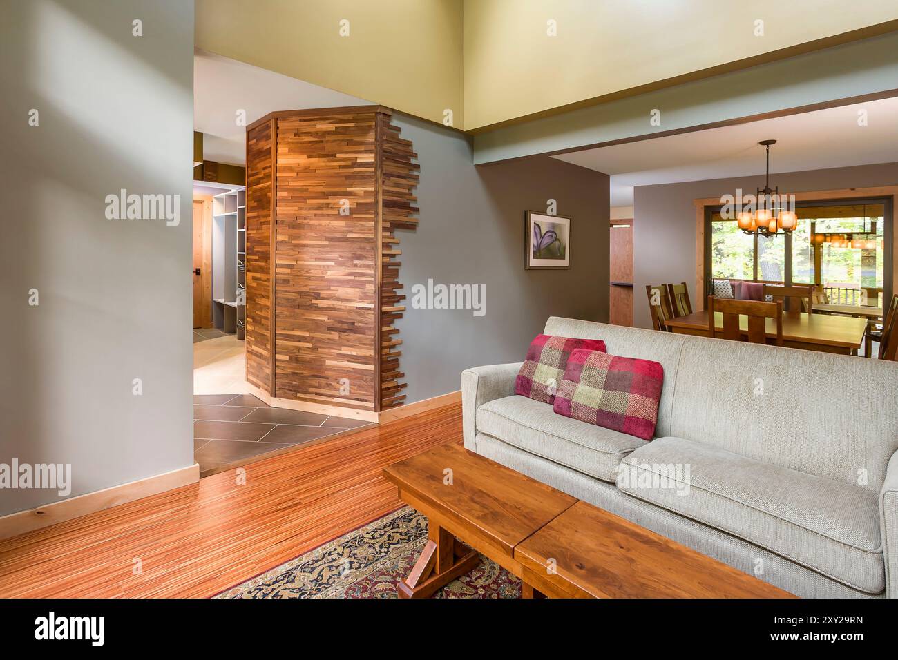 Transition from front hallway to living room to dining room Stock Photo ...