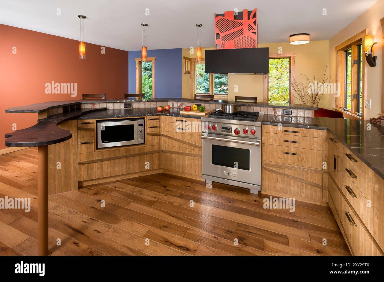 Large kitchen with circular cabinets and unique irregular peninsula ...