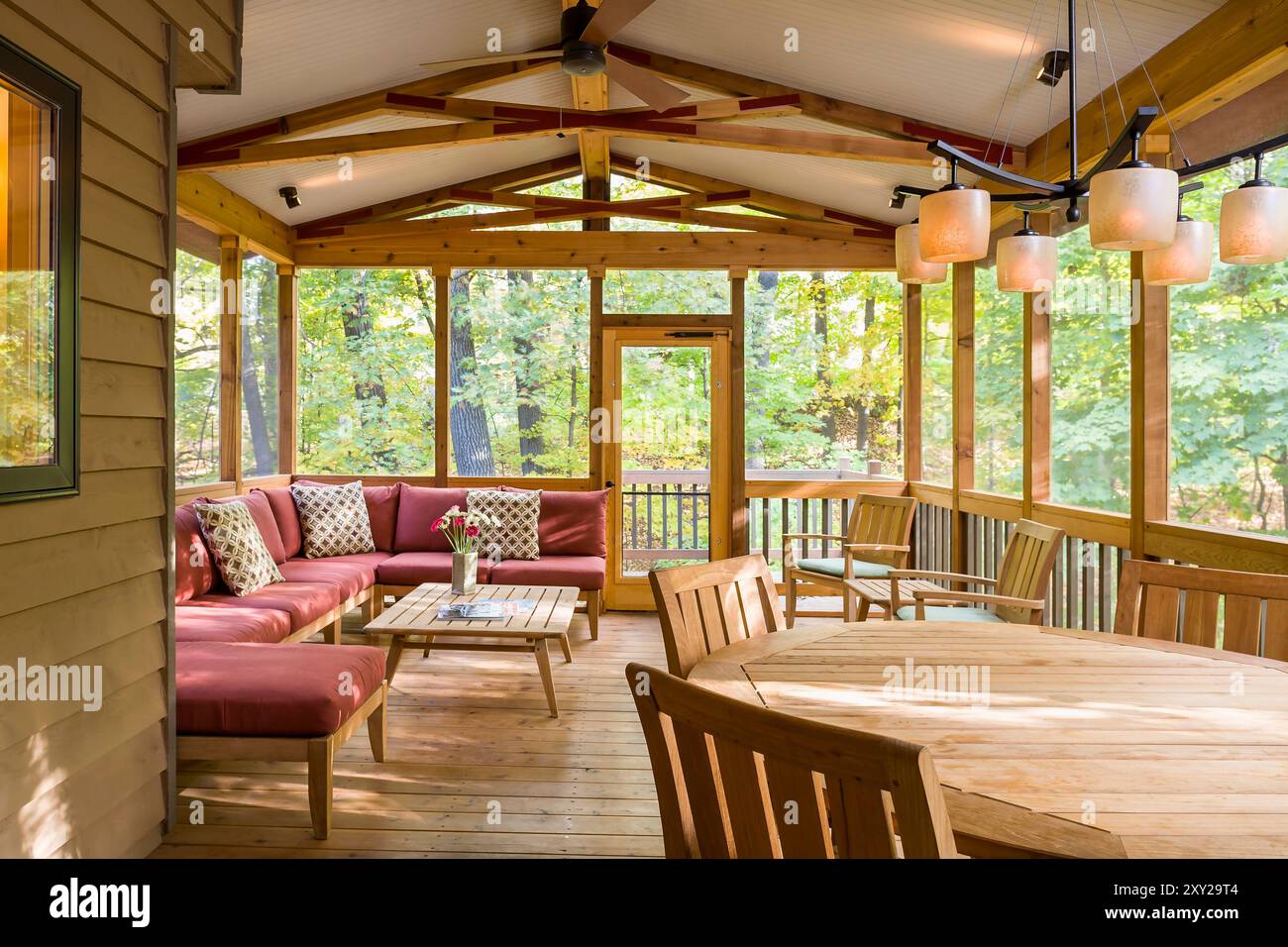 Screened porch with nice wood outdoor furniture and view of lots of ...