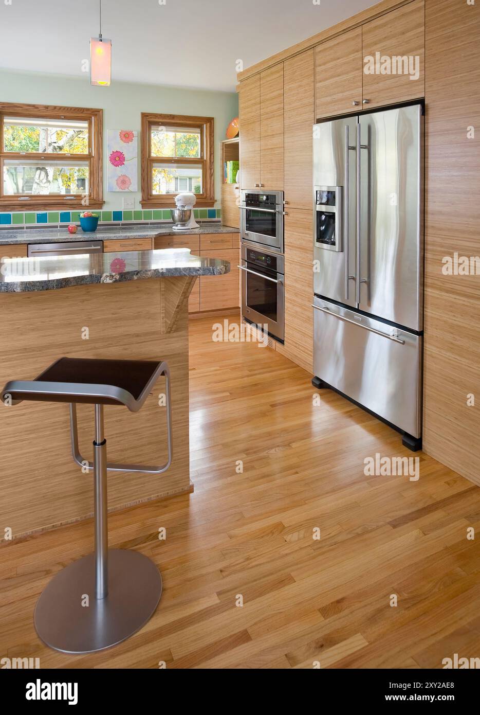 Modern steel bar stool and bamboo kitchen cabinets Stock Photo - Alamy