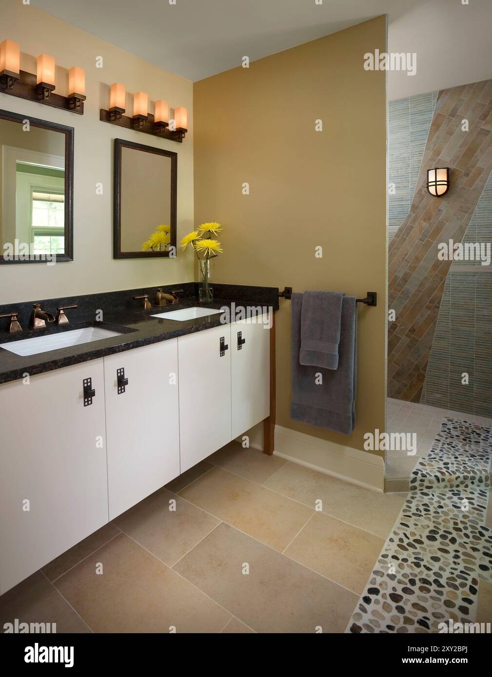 Modern bathroom with double vanity and mix of tiles on floor and walls ...