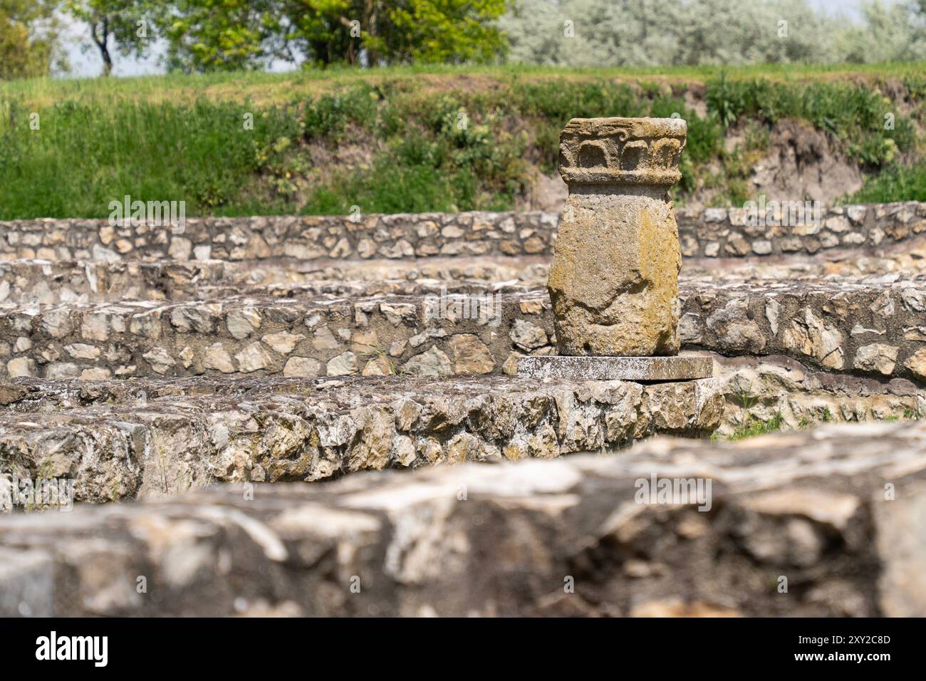 Old stone column remains among the ruins of an ancient Roman building ...