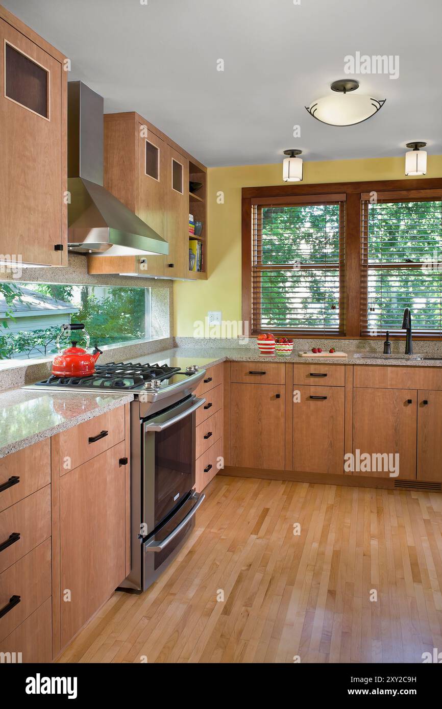Contemporary kitchen with cherry cabinets and long horizontal window ...