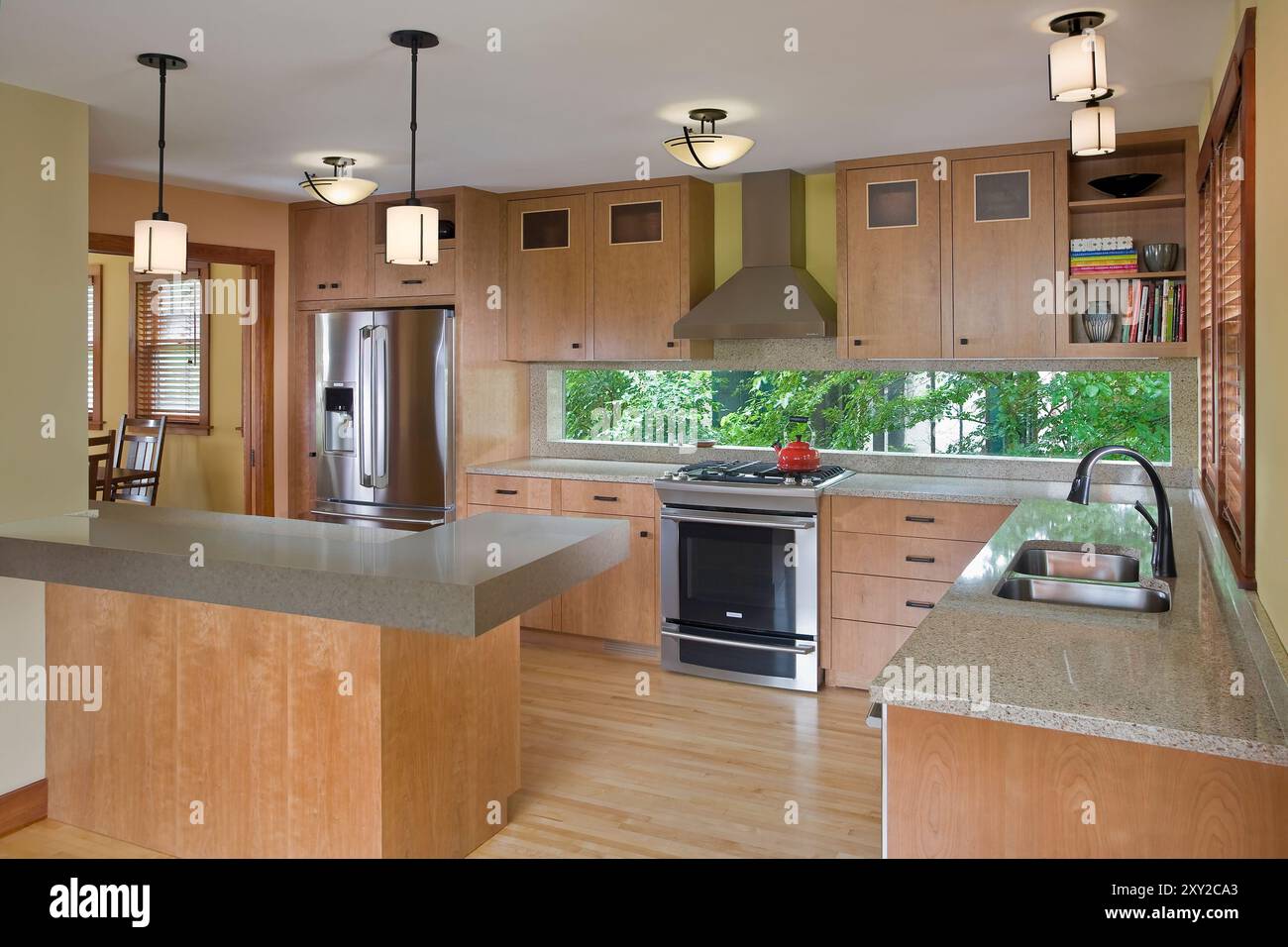 Modern kitchen with long horizontal window on wall between countertop ...
