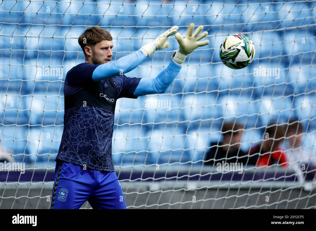 Coventry City goalkeeper Bradley Collins warms up before the Carabao ...