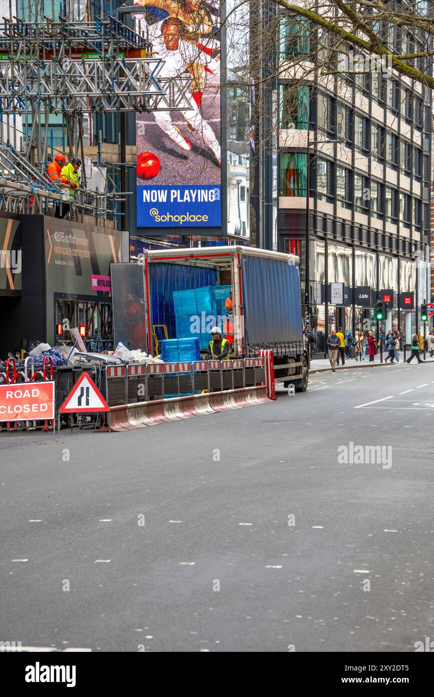 Central London street with a building under construction with ...