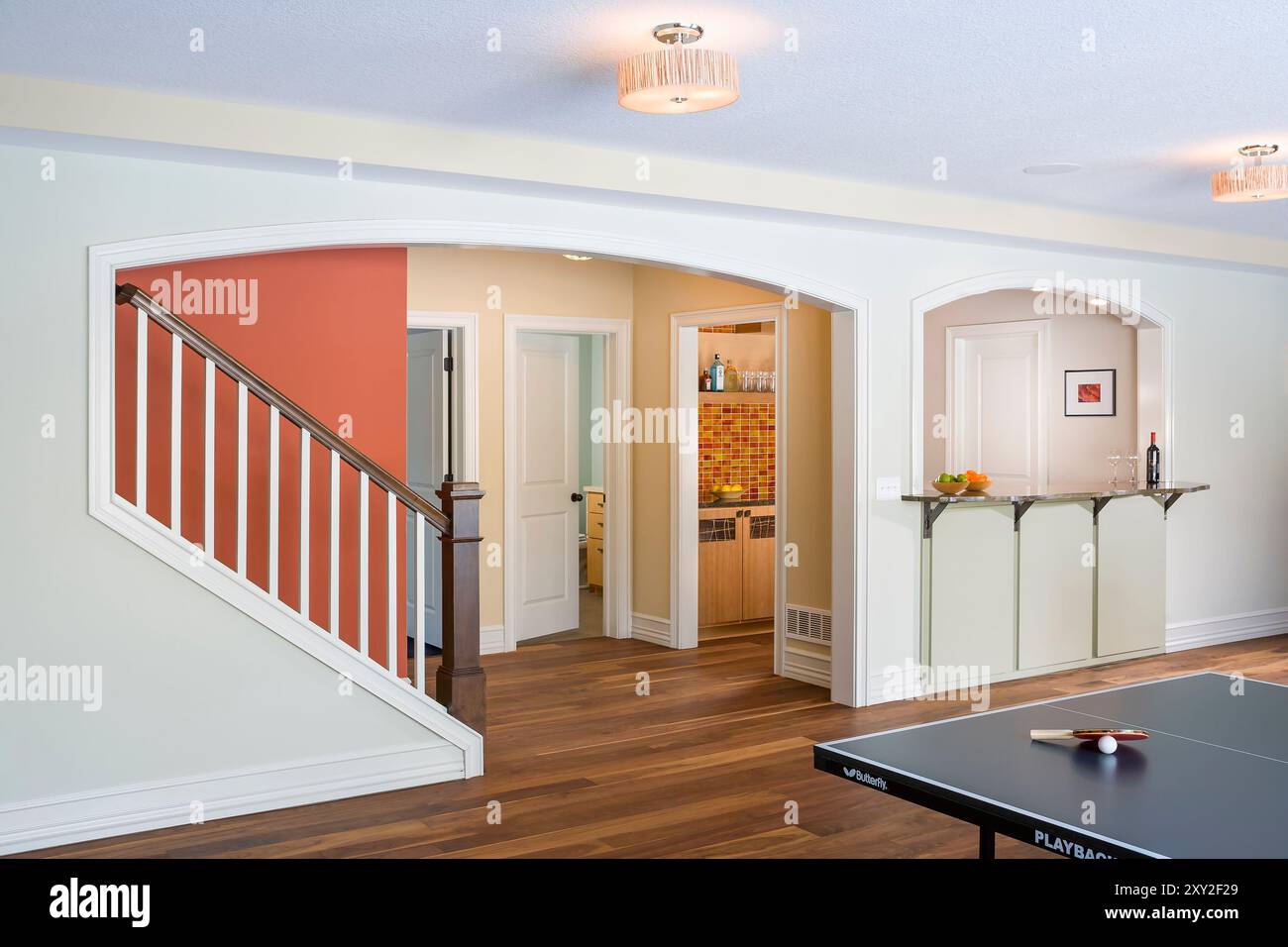 Basement family room with ping pong table and bar Stock Photo - Alamy