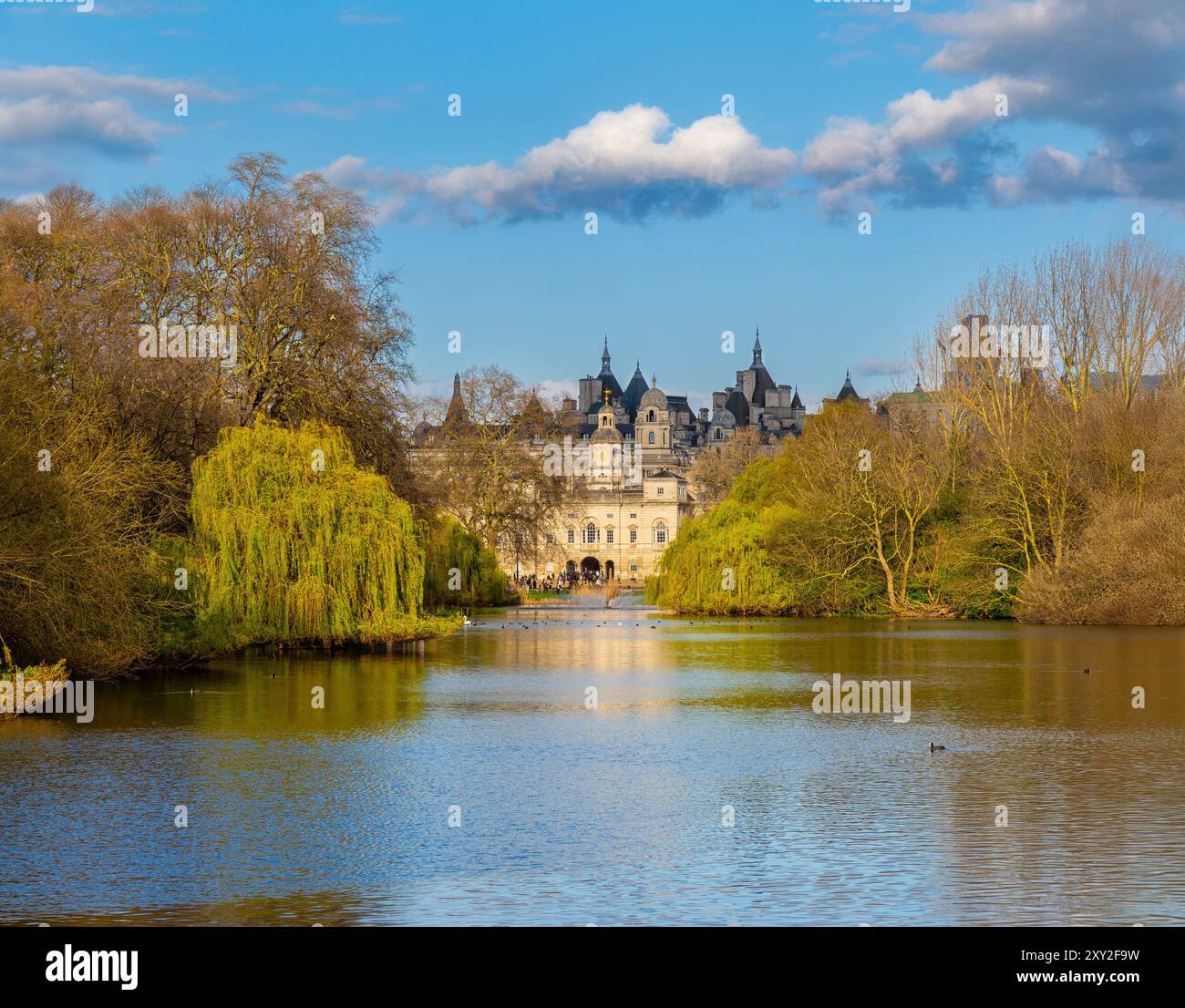 Panoramic view of St James' Park lake illuminated by sunset sunlight ...