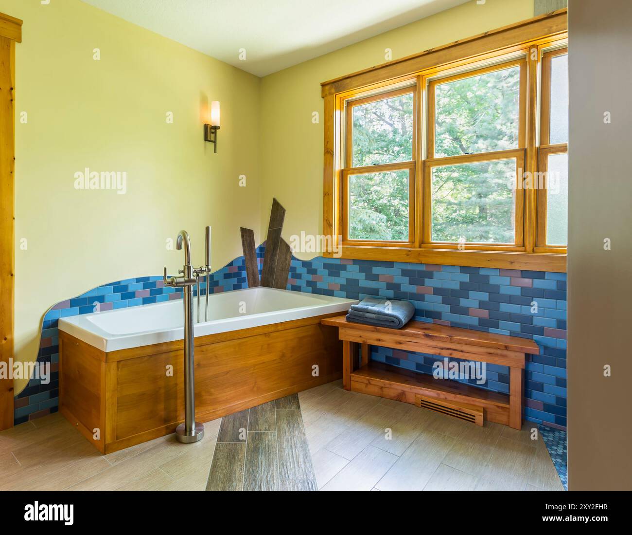 Colorful master bathroom showing Duravit soaking tub with wood ...