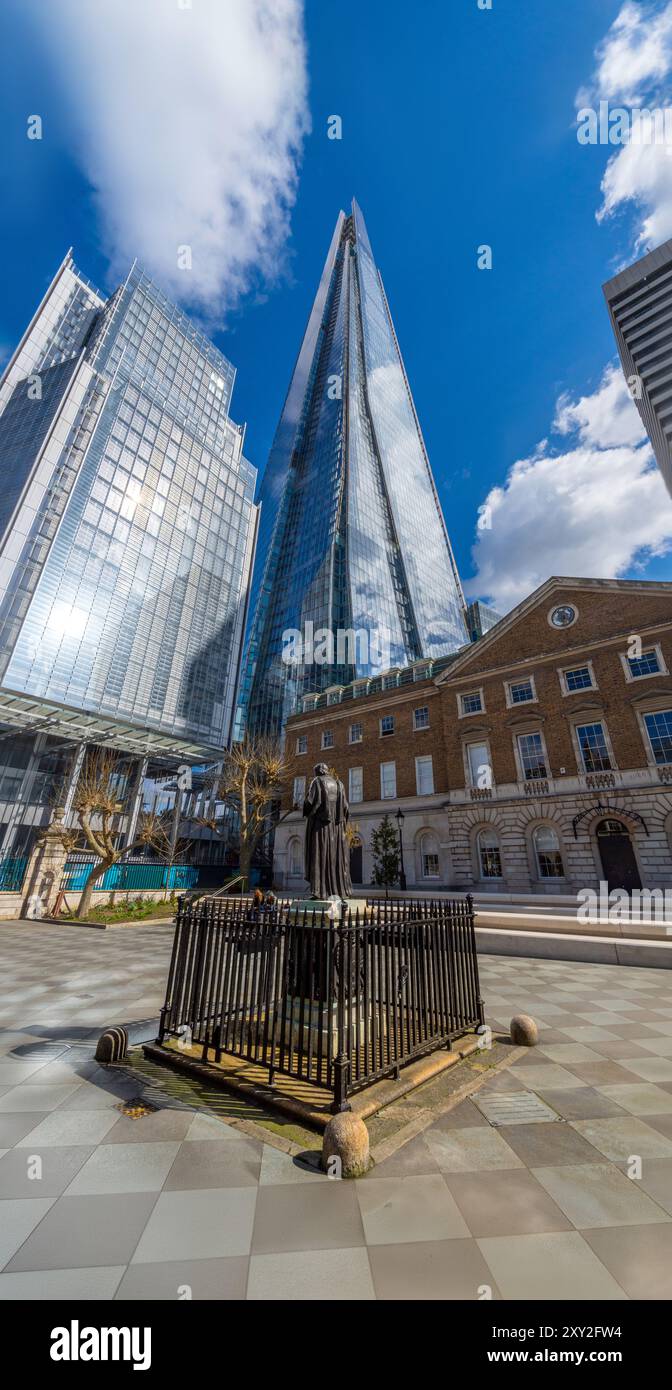 Low angle view from a courtyard of the modern glass skyscraper The ...