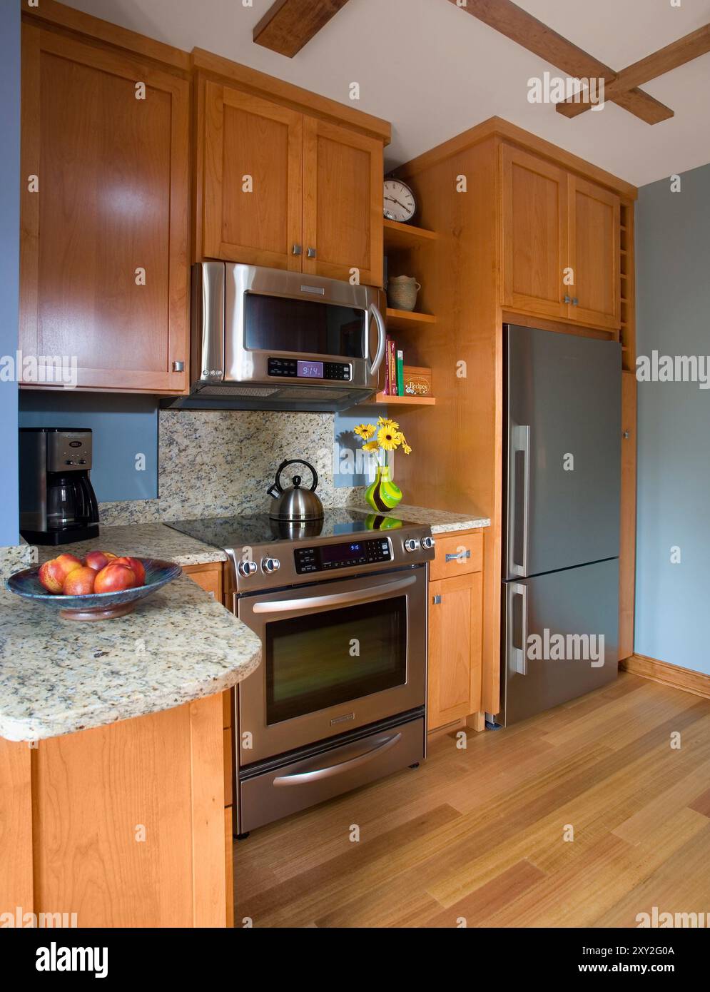 Half of kitchen showing stainless steel stove and refrigerator hi-res ...