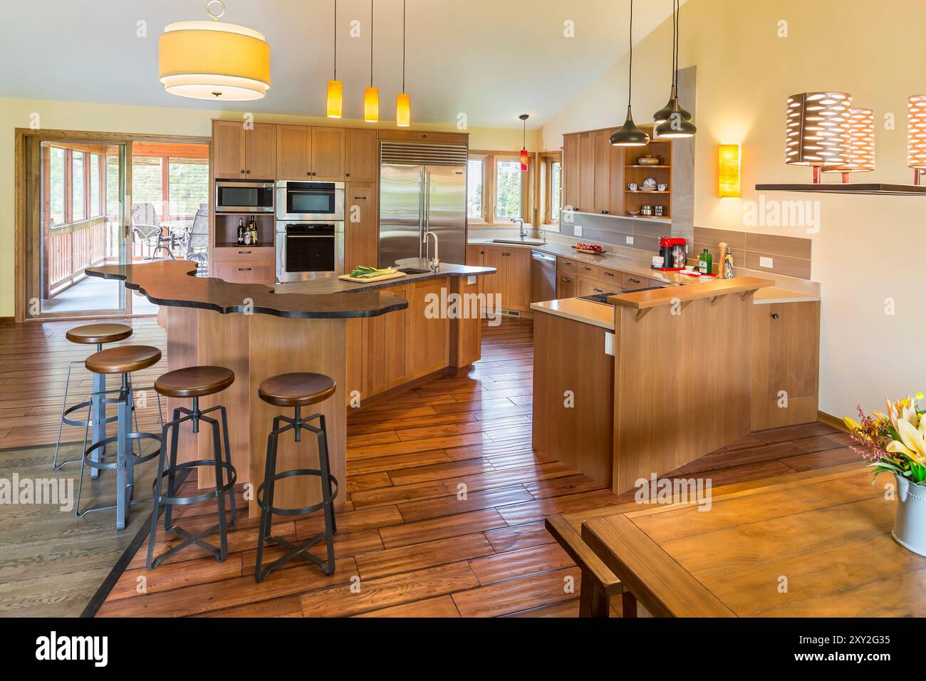 Kitchen with interesting floor plan and T-shaped kitchen island Stock ...
