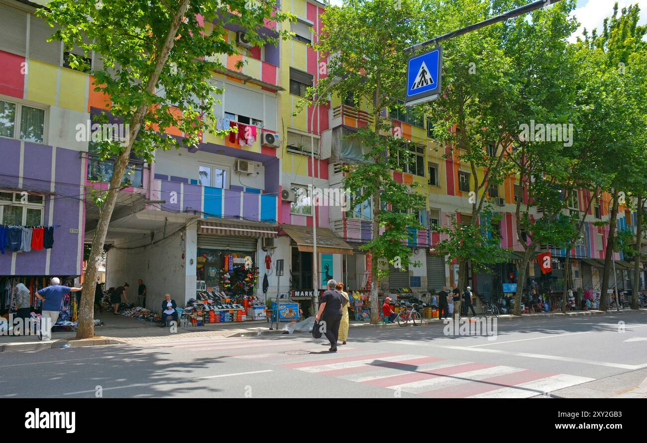Tirana, Albania - May 30th 2024. Colourful buildings on the tree-lined ...
