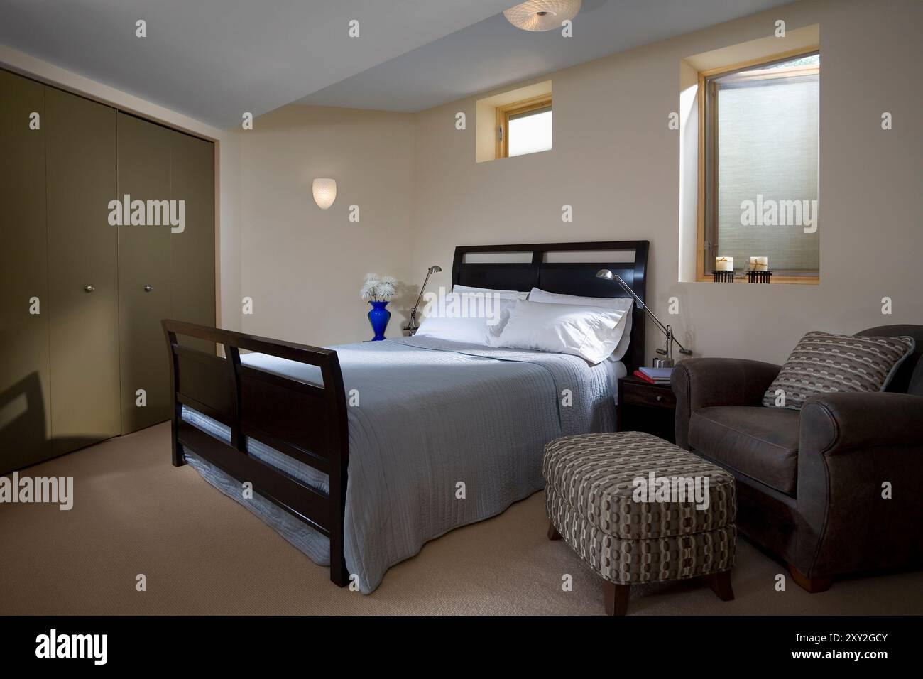 Basement bedroom with one small window and one large egress window ...