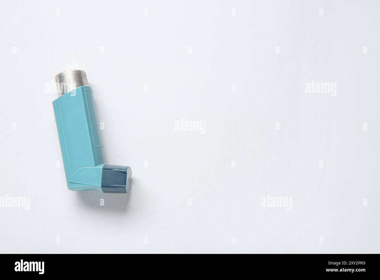 Asthma inhaler on grey background Stock Photo - Alamy