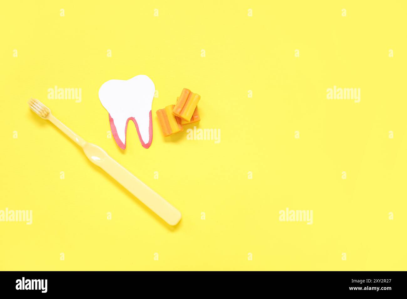 Paper tooth with brush and chewing gums on yellow background Stock ...