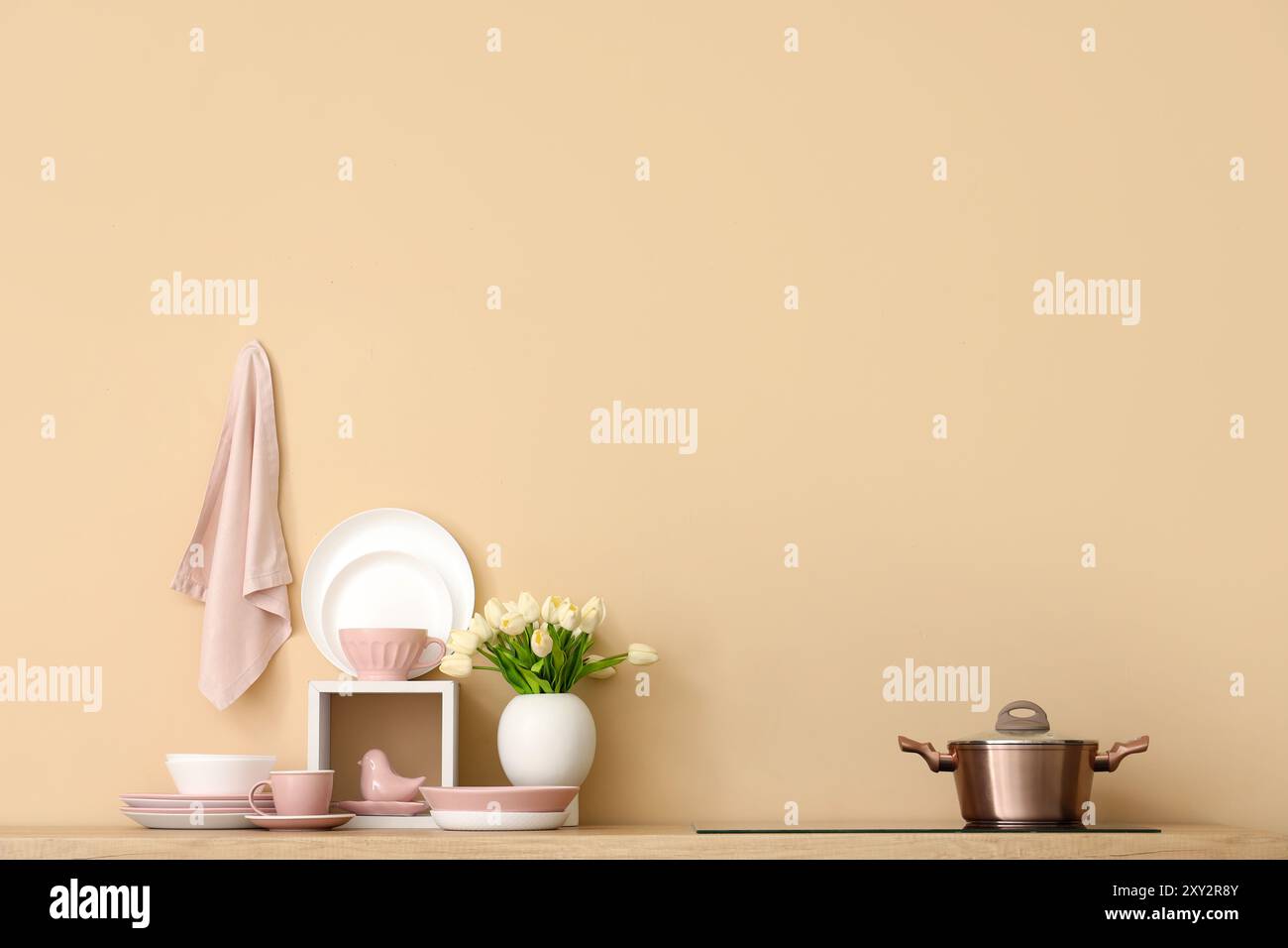 Kitchen counters with clean dishes, electric stove and cooking pot ...