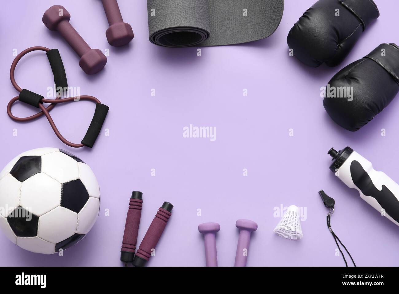 Frame made of sports equipment on lilac background Stock Photo - Alamy