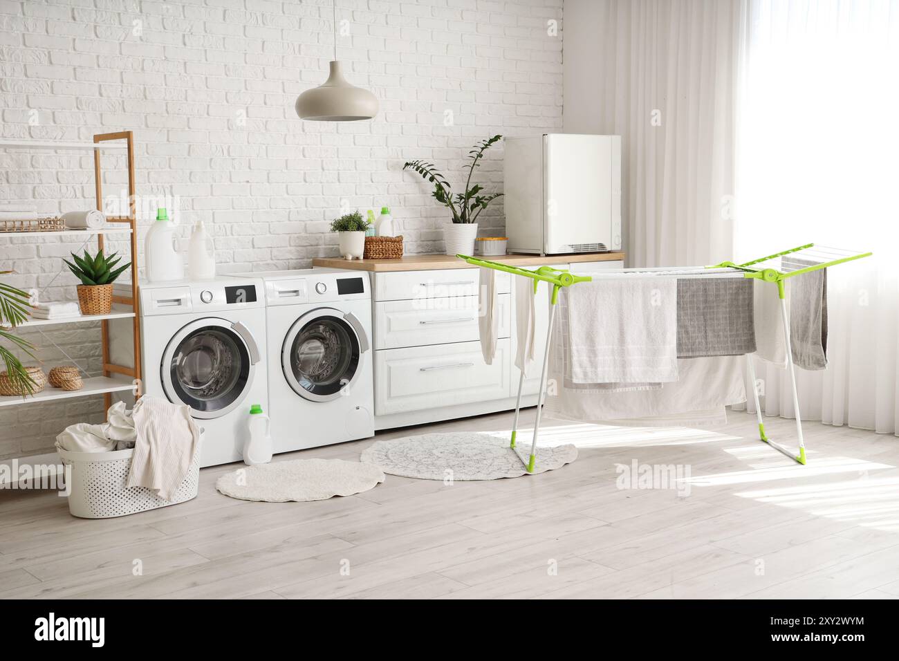 Interior of laundry room with dryer and washing machines Stock Photo ...