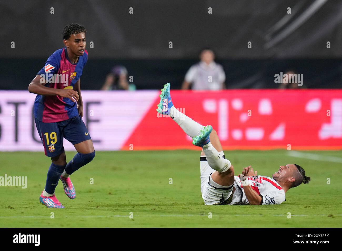 Barcelona's Lamine Yamal, left, and Rayo's Alfonso Espino during the ...