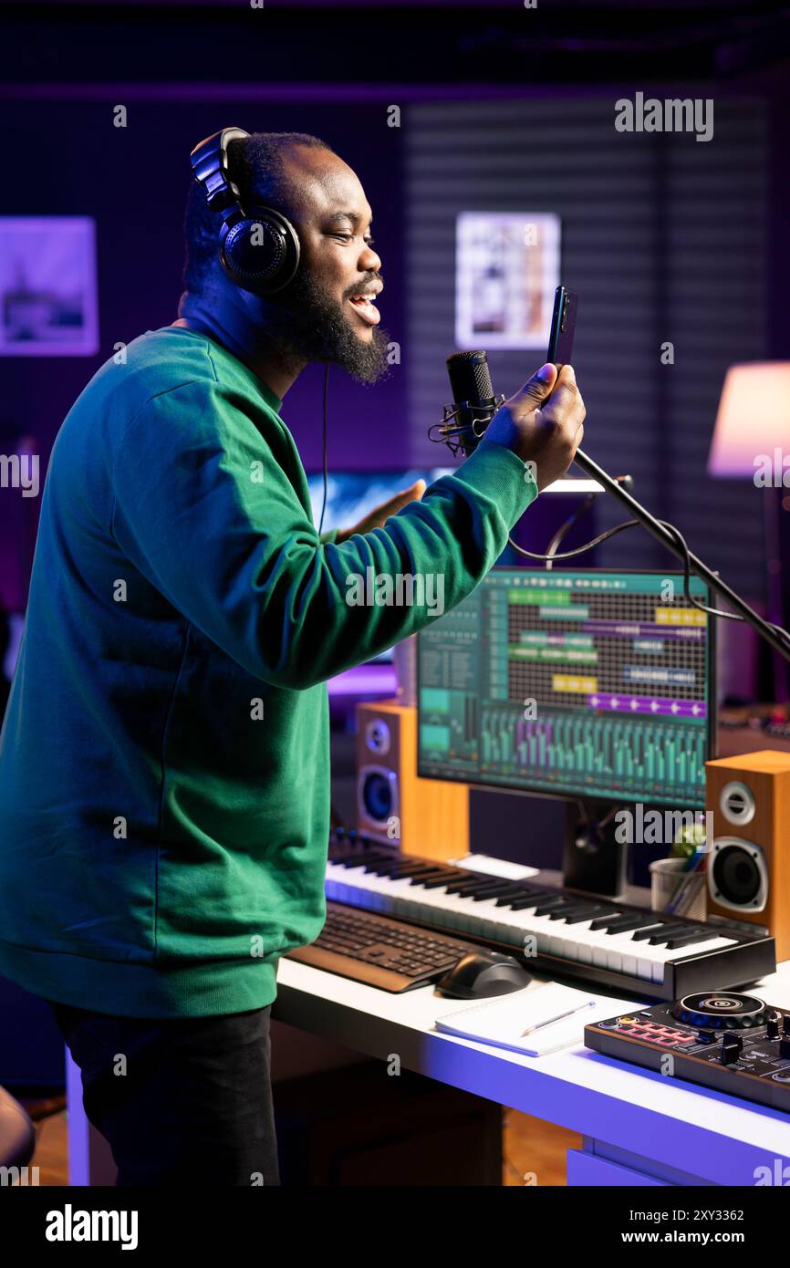 Talented performer singer does a recording session for his acoustic ...