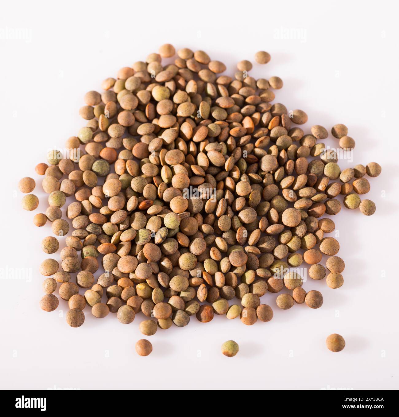 Top view of pile of lentils on white background Stock Photo - Alamy