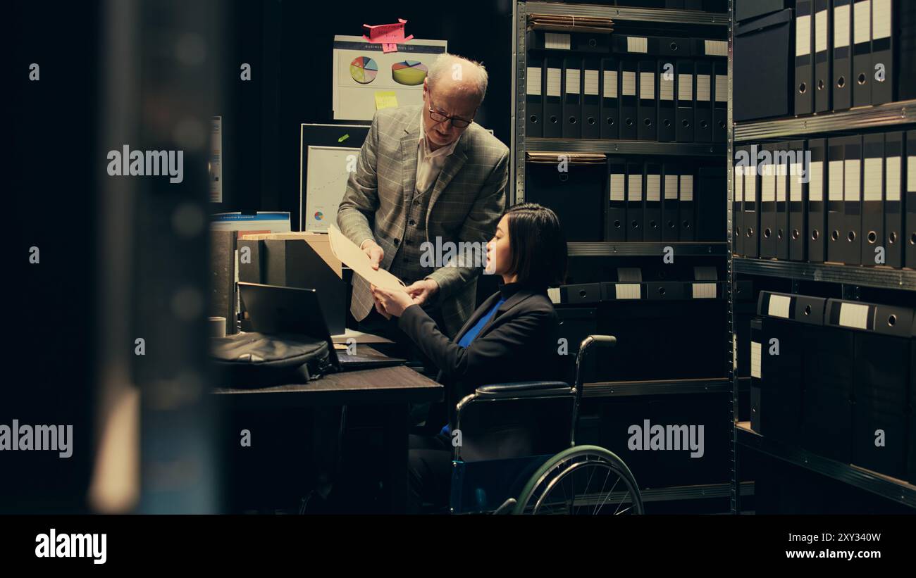 Law officer examining physical evidence hi-res stock photography and ...