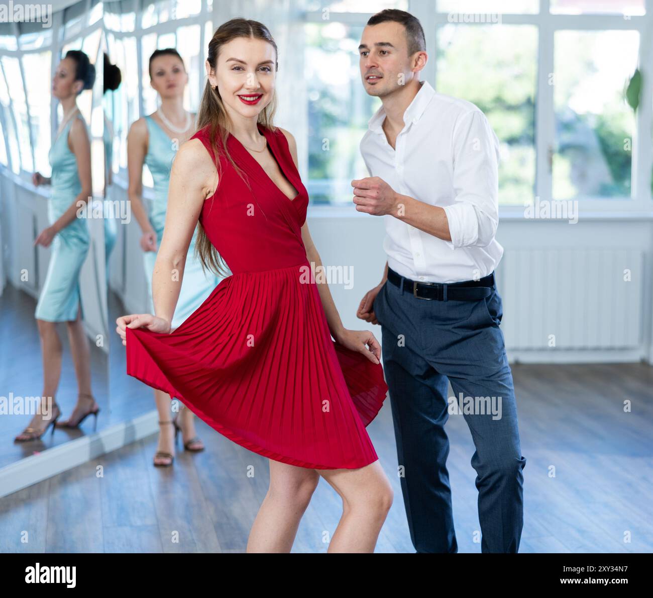 Couple in stage costumes learns boogie woogie dancing during individual ...