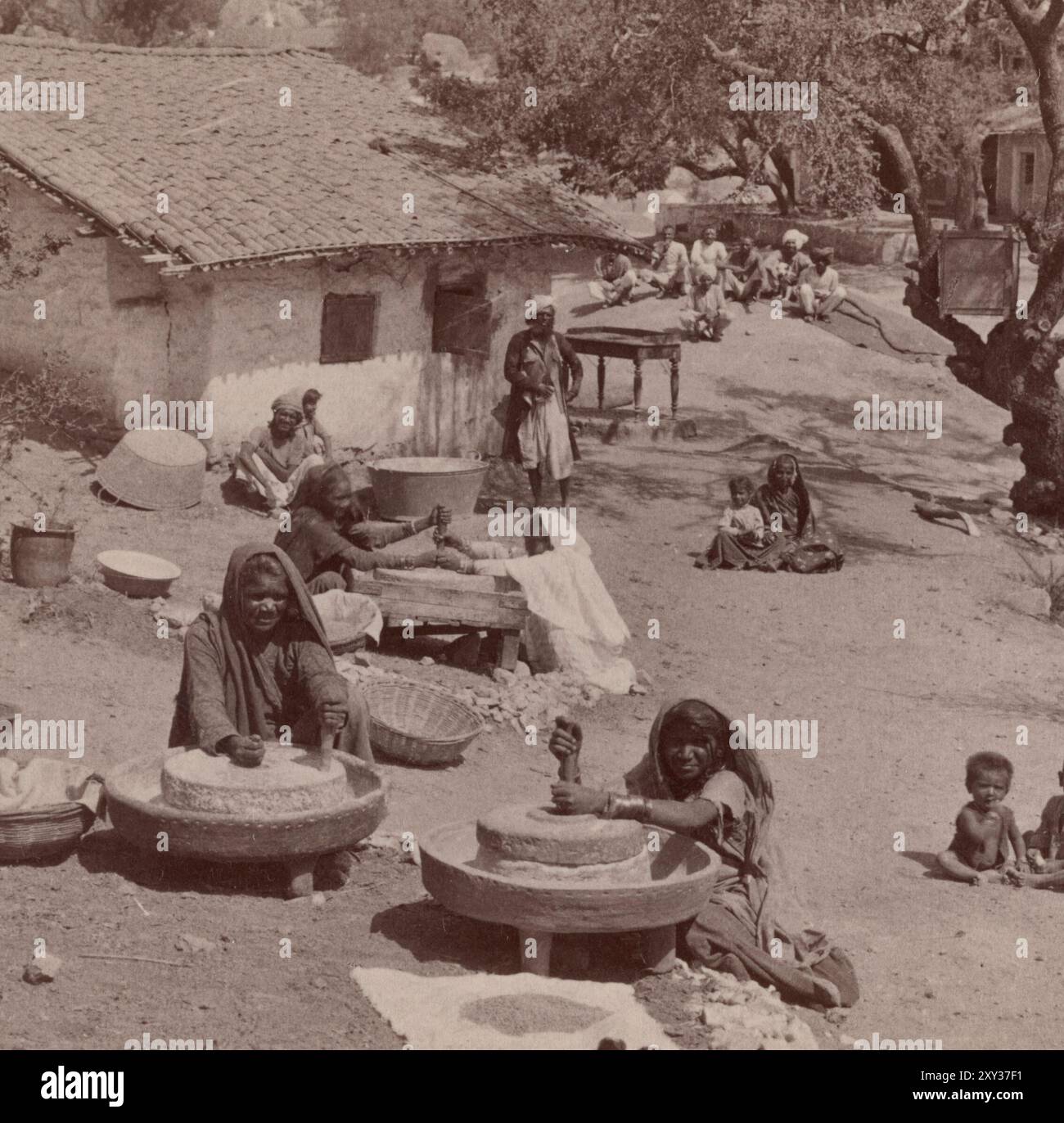 Primitive native life of India, Hindu women grinding at the mills ...