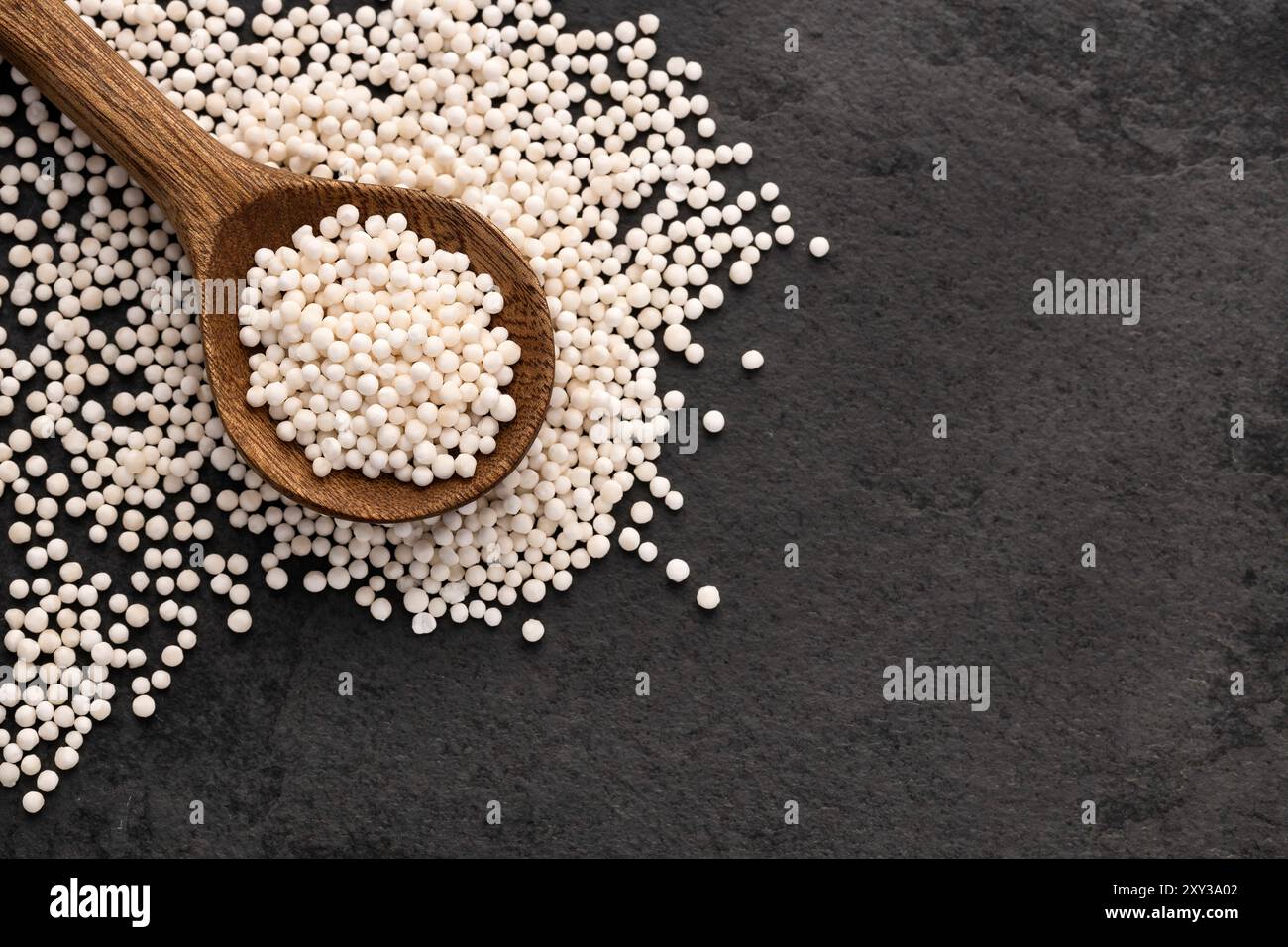Tapioca pearls from cassava root - White sagu balls on the spoon ...
