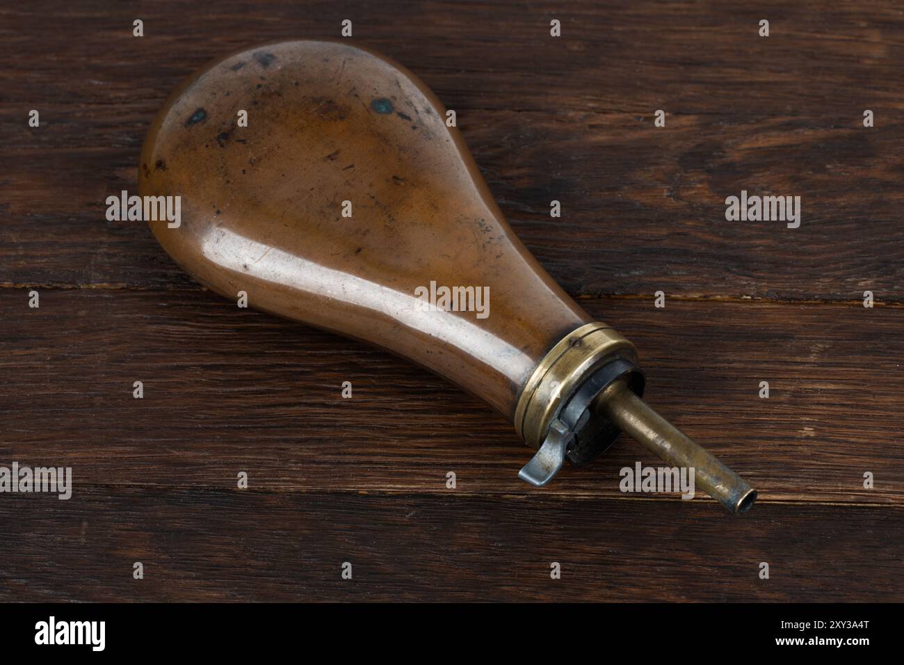 Old west gunpowder flask on wood deck background Stock Photo - Alamy