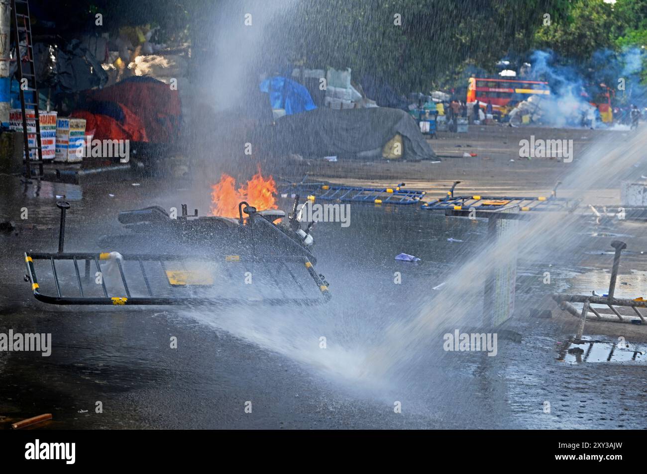 Kolkata, West Bengal, India. 27th Aug, 2024. The mob set fire to a Bike ...