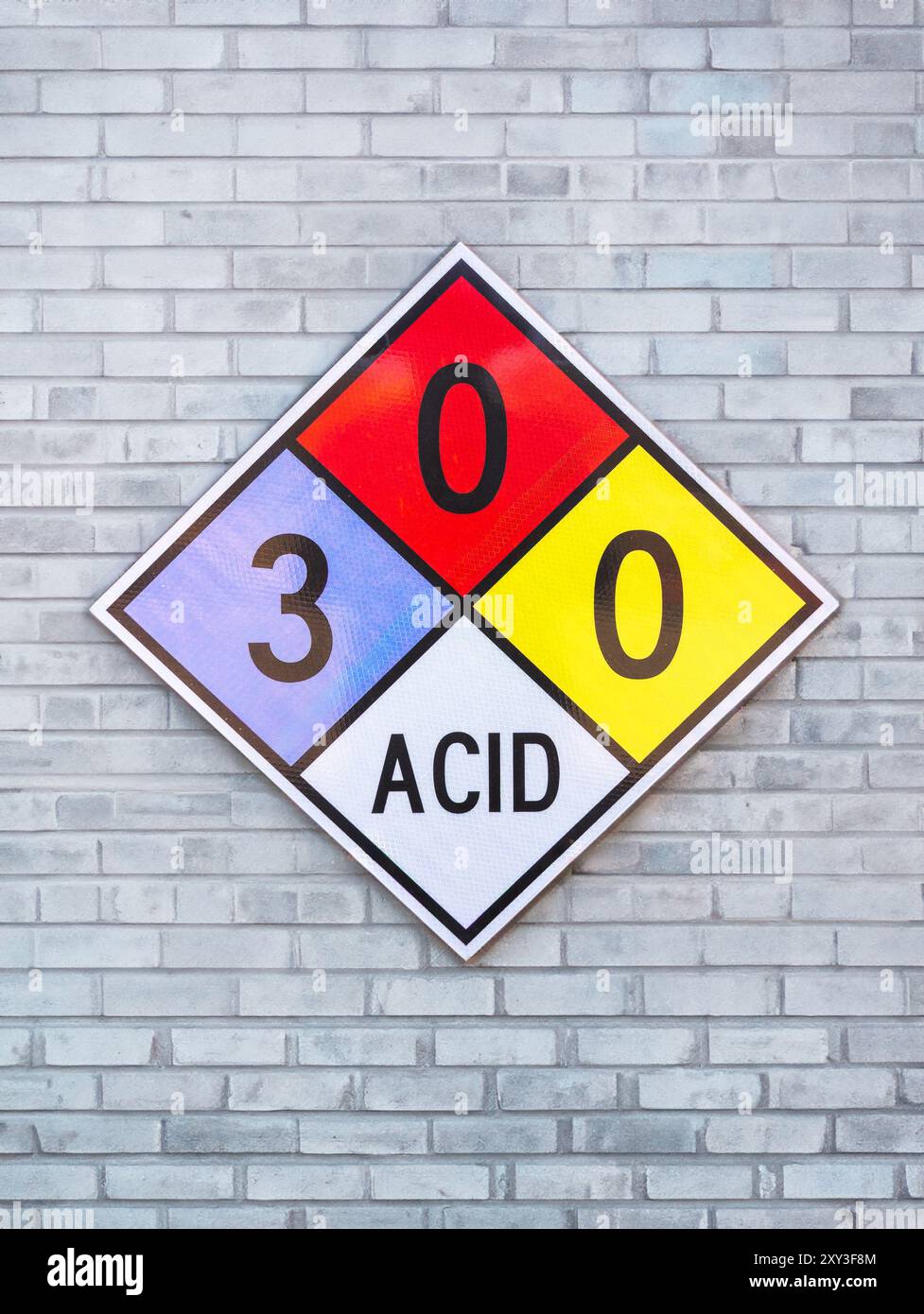 Diamond shaped NFPA panel identifying hazardous chemicals inside fenced ...