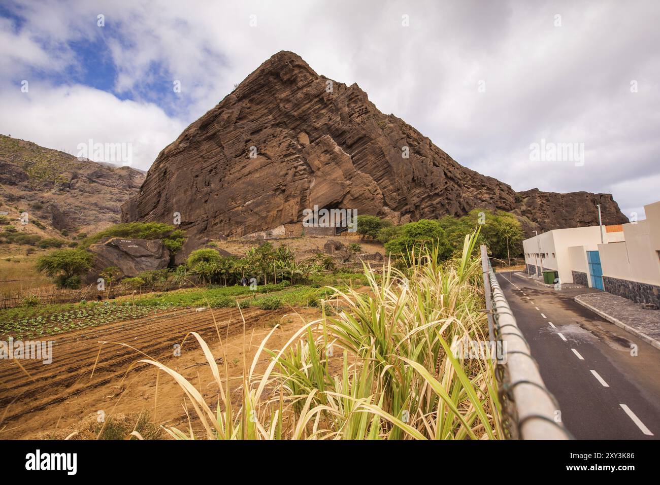 Small mountain with steep slopes rising out of the landscape Stock ...