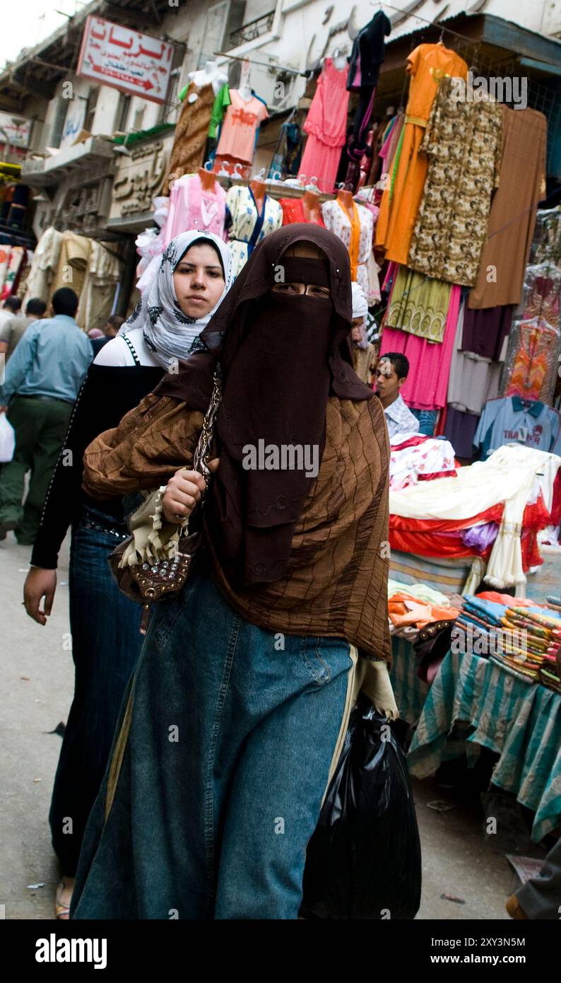 Veiled Egyptian women shopping at the vibrant markets in Islamic Cairo, Cairo, Egypt Stock Photo ...