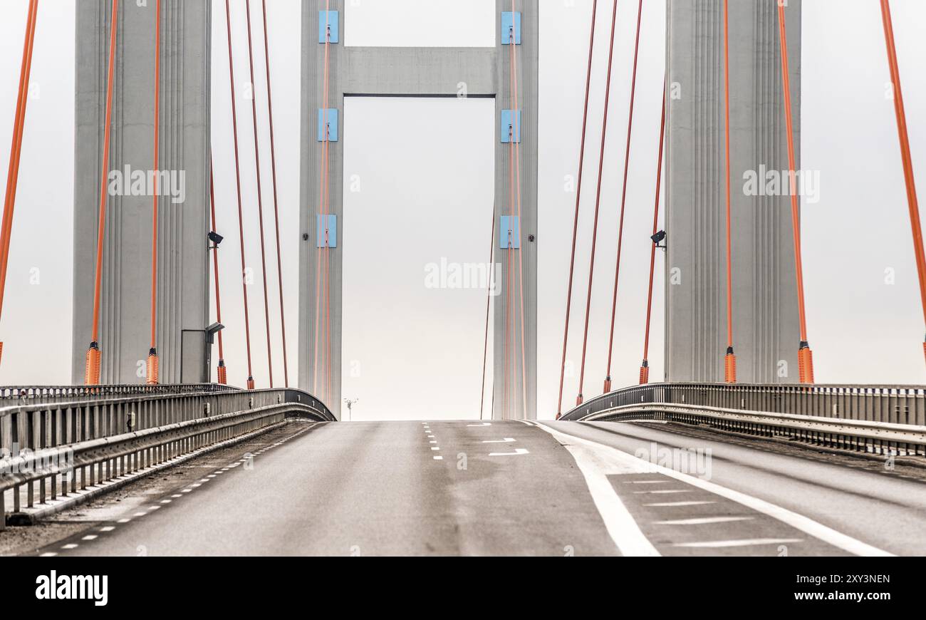 Grey Cable-stayed bridge with orange and blue details Stock Photo - Alamy