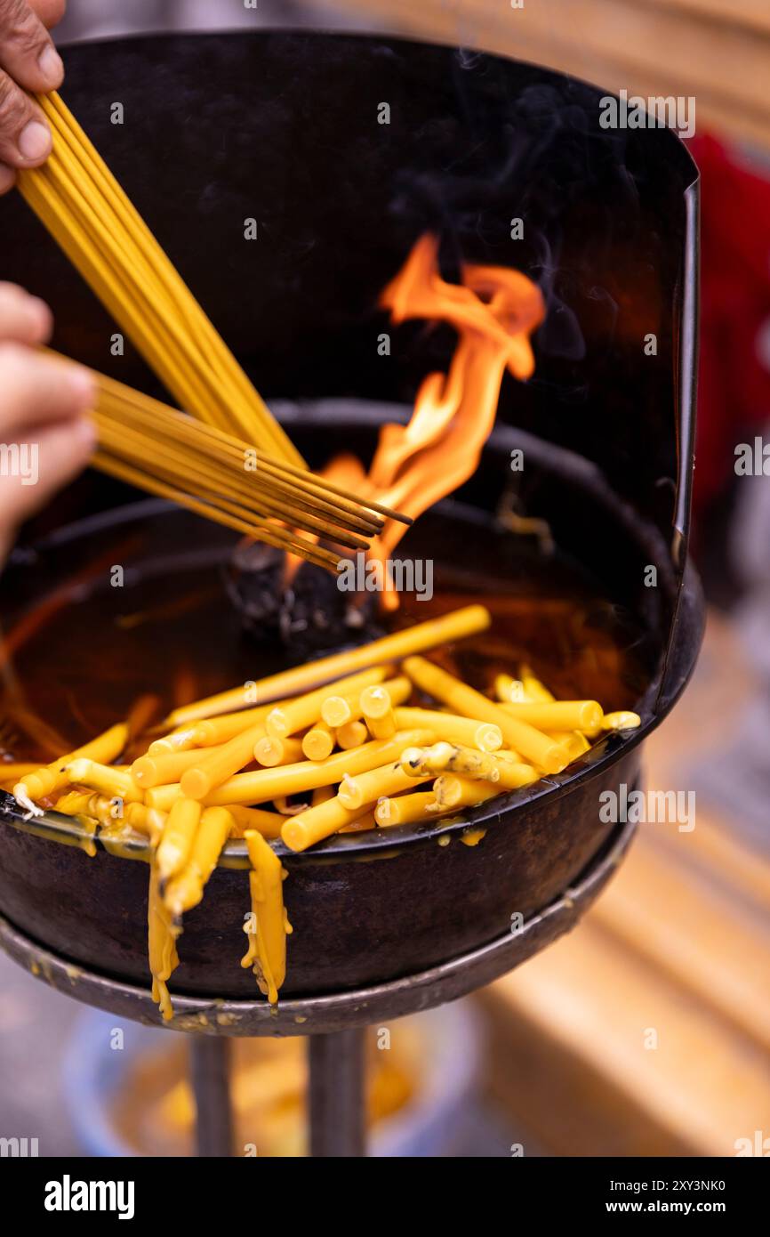 Visitors lighting incense sticks at Lok Ta Dombong Dek, Lok Ta Krohom ...