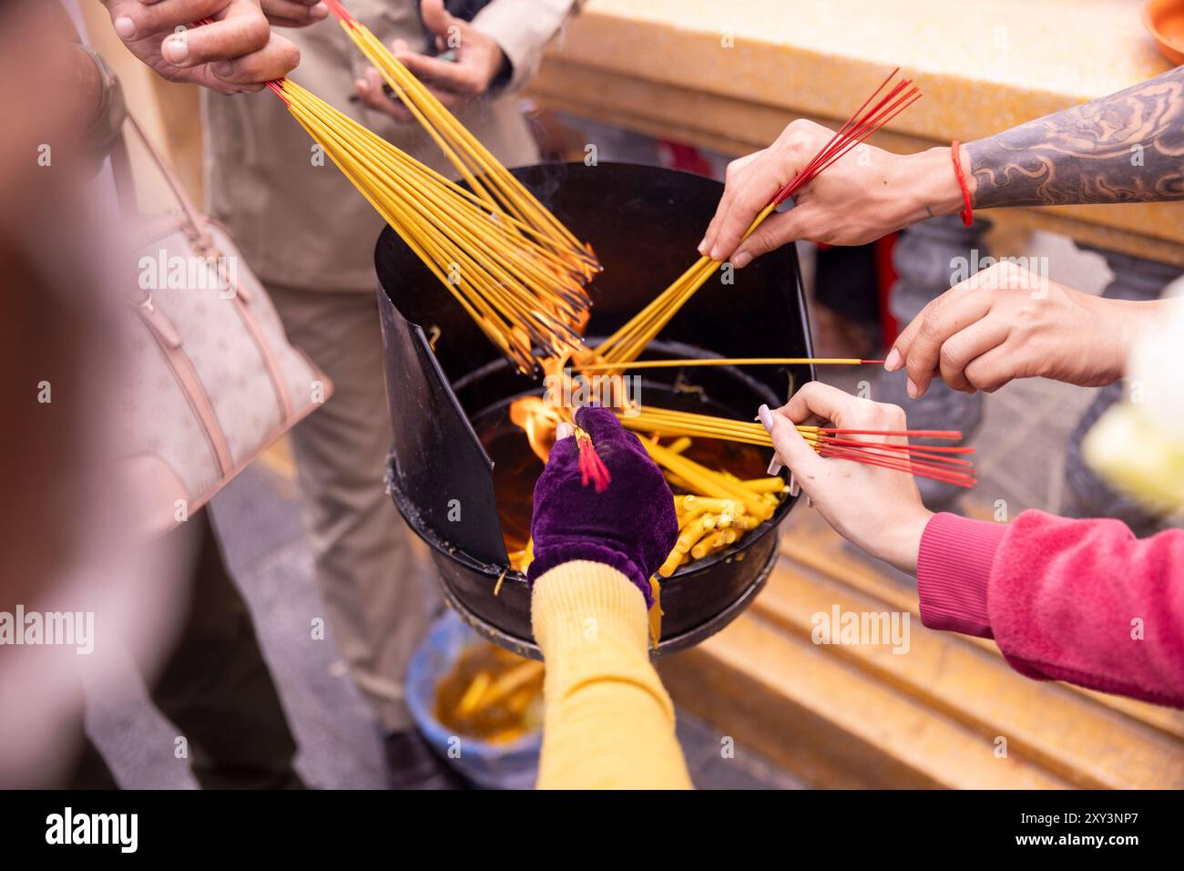 Visitors lighting incense sticks at Lok Ta Dombong Dek, Lok Ta Krohom ...