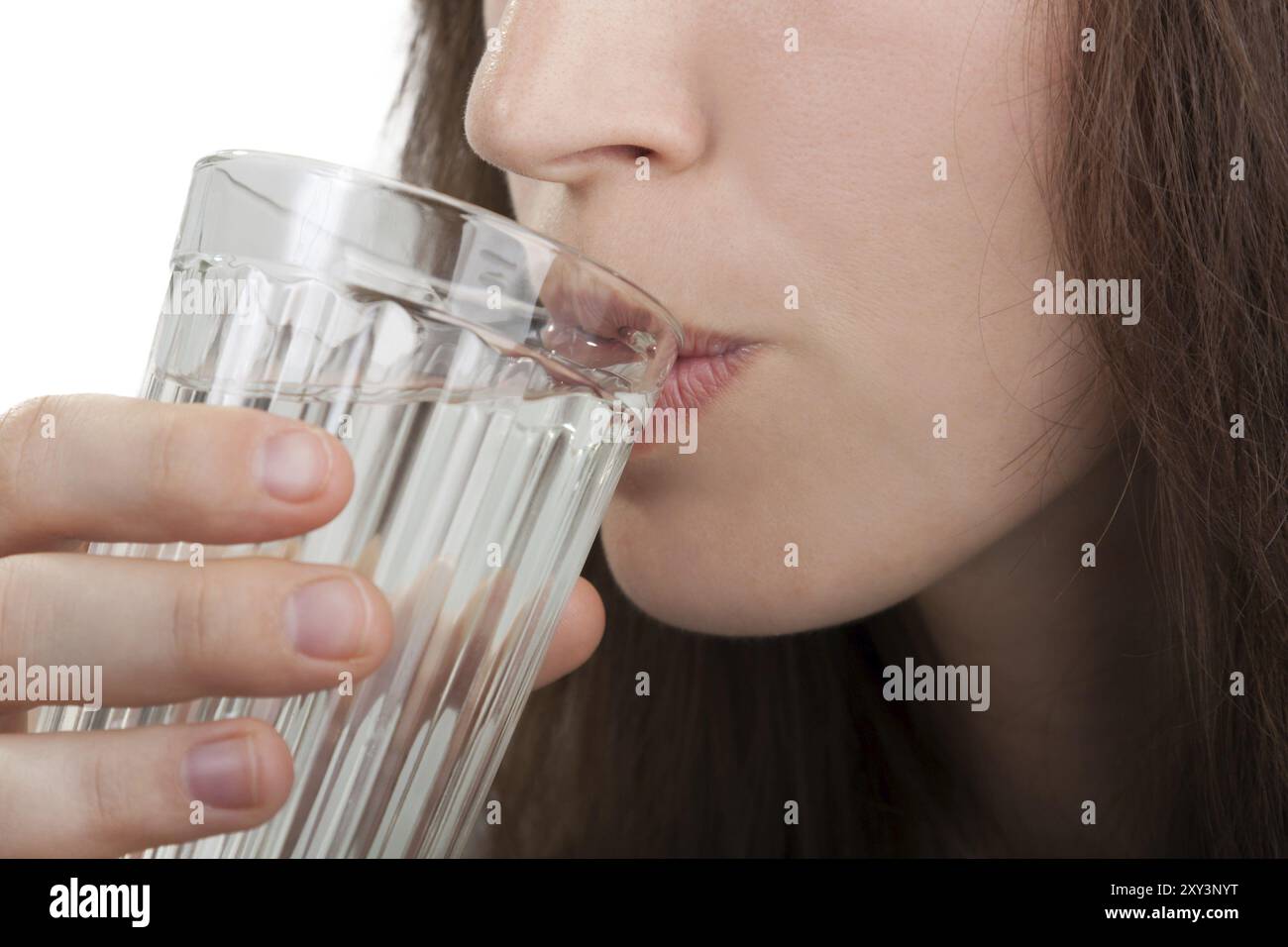 Female human hand holding liquid drink water glass Stock Photo - Alamy