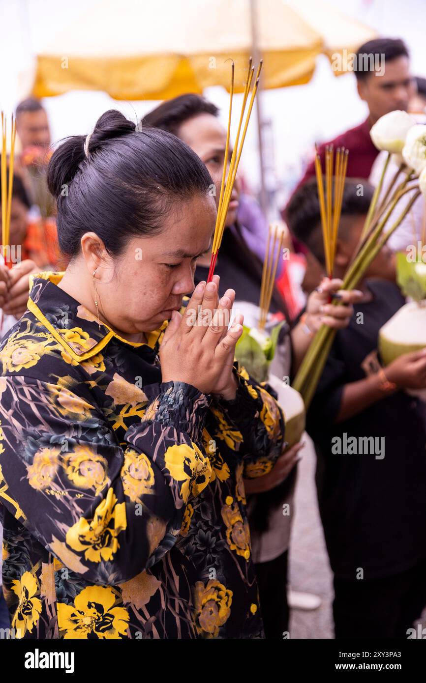 Visitors praying at Lok Ta Dombong Dek, Lok Ta Krohom Ko and Lokta ...