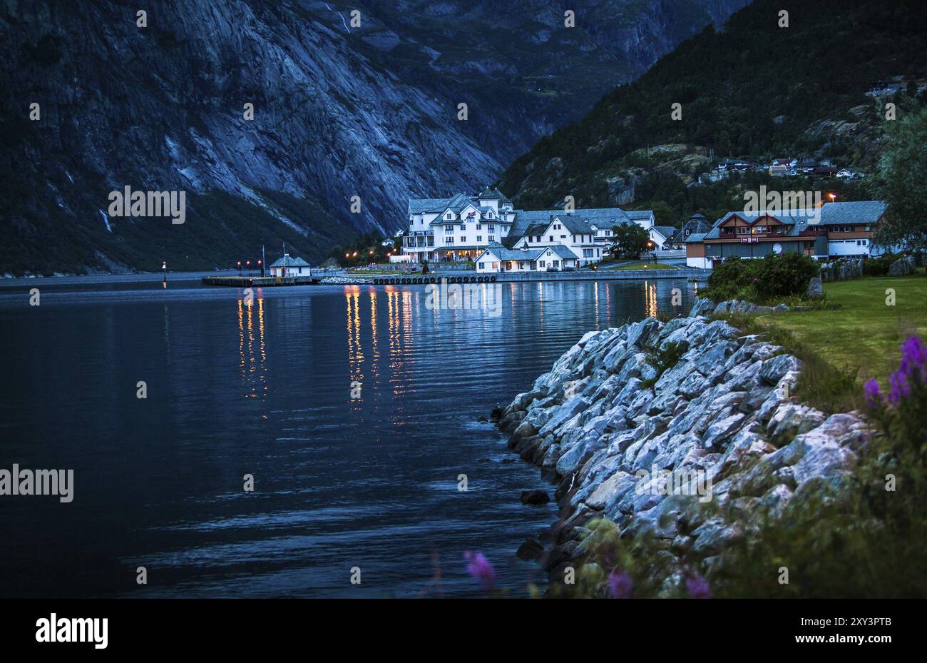 NORWAY, JULY 17: shore village at the foot of a mountain on July 17 ...