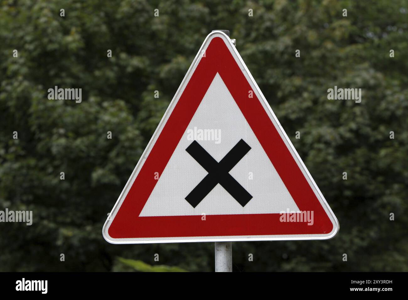 Crossing sign with right of way from the right Stock Photo - Alamy