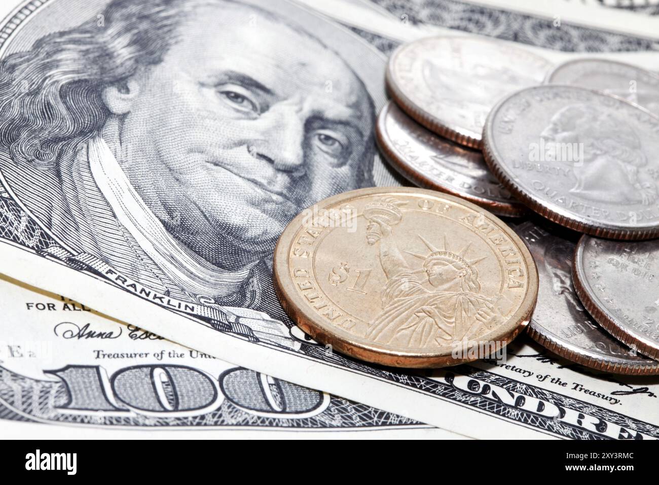 Coins on dollars background Stock Photo - Alamy