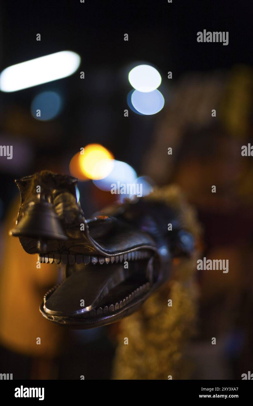 The mouth of an animal is formed from metal which caps the end of a ...